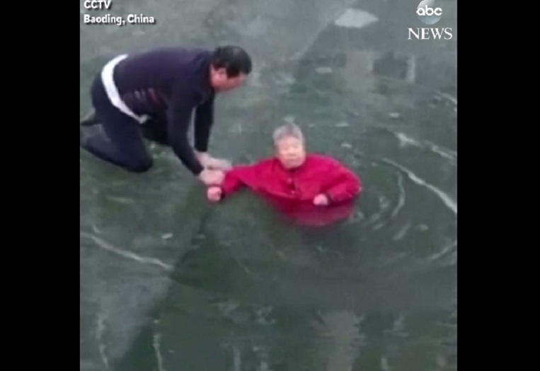 WATCH: Man Risks Own Life to Rescue 70-Year-Old Woman Who Fell in ...