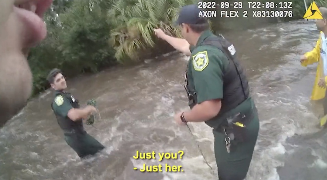 ‘Is Anybody in There?!’: Cops Form Human Chain to Save Woman Trapped in Car Amid Raging ...